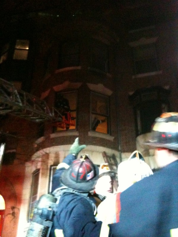 Boston firefighters use ladders to rescue two people from burning Back ...