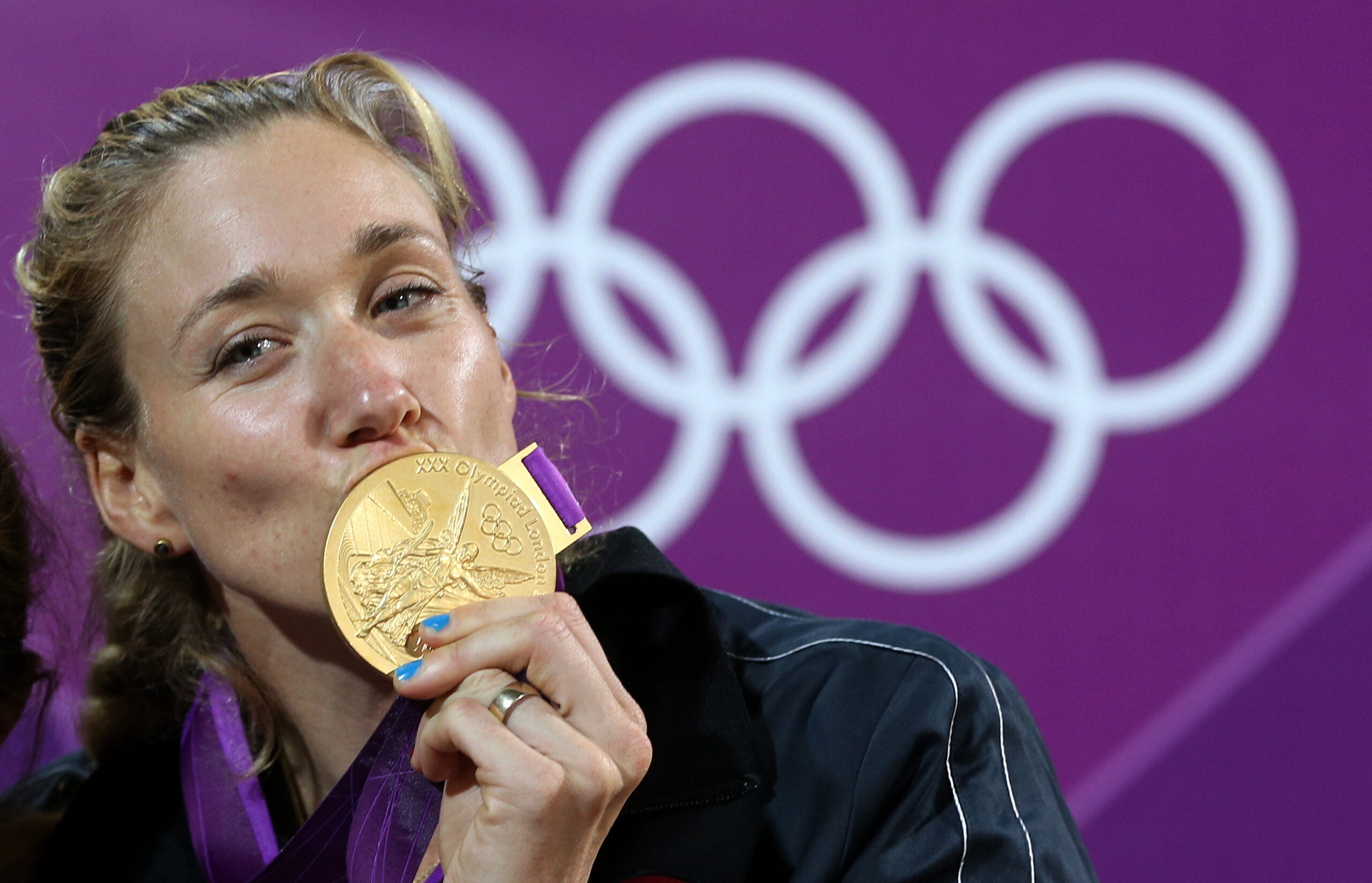 Kerri Walsh Jennings drops her gold medal