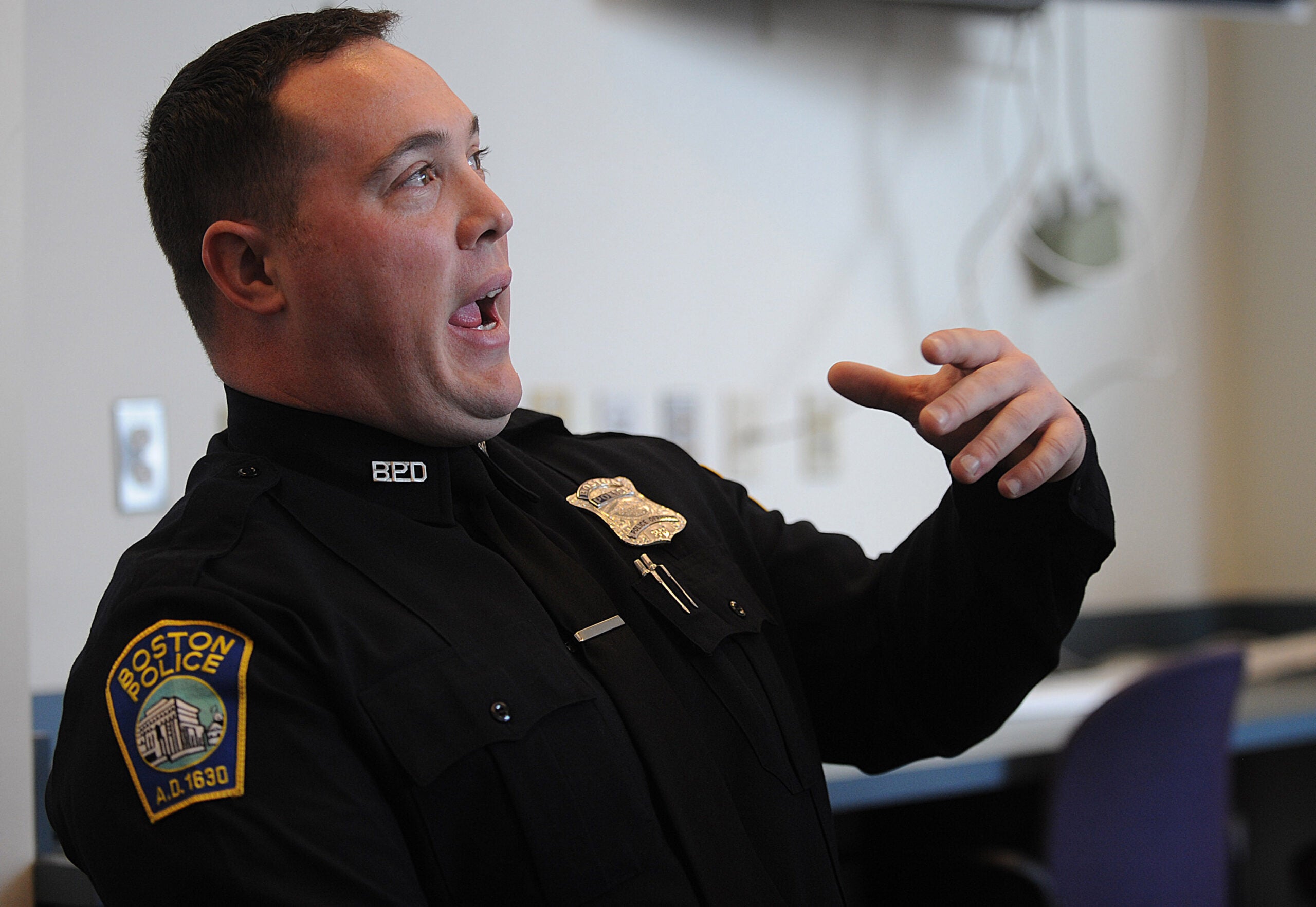 Boston officer credited with breaking fall of woman who fell headfirst ...