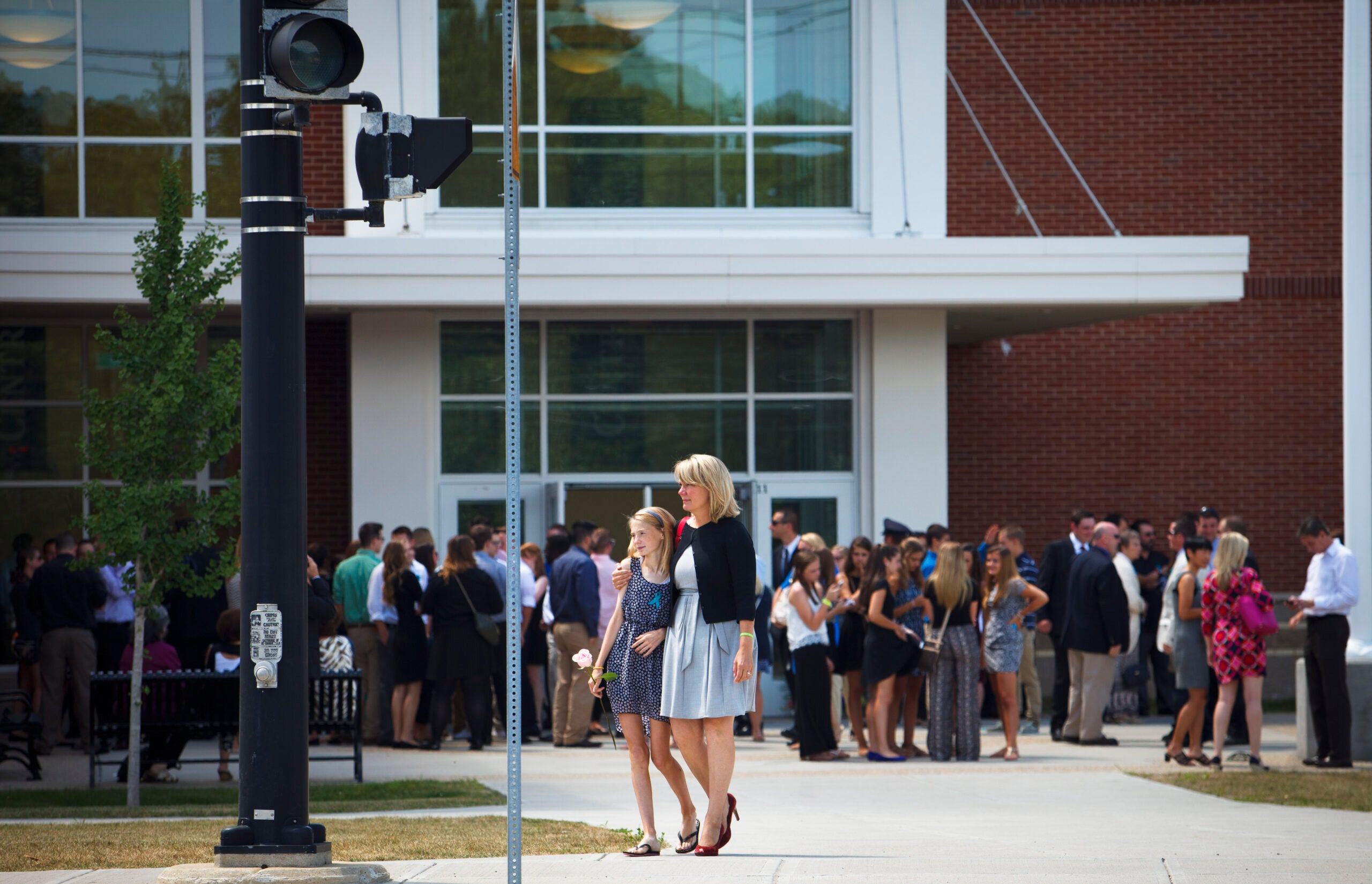 Teacher killed in hit-and-run mourned by hundreds at former school