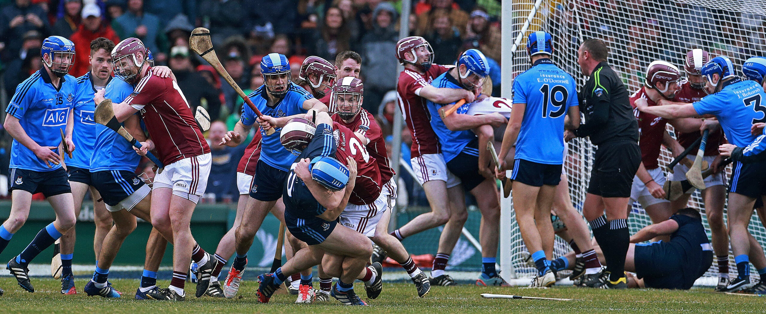 Watch Irish hurling players get into a huge brawl during match at ...