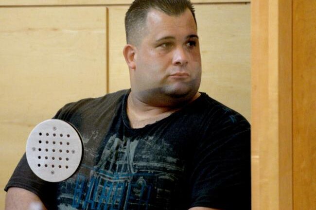 Man accused of killing dogs flips off animal rights activists in court