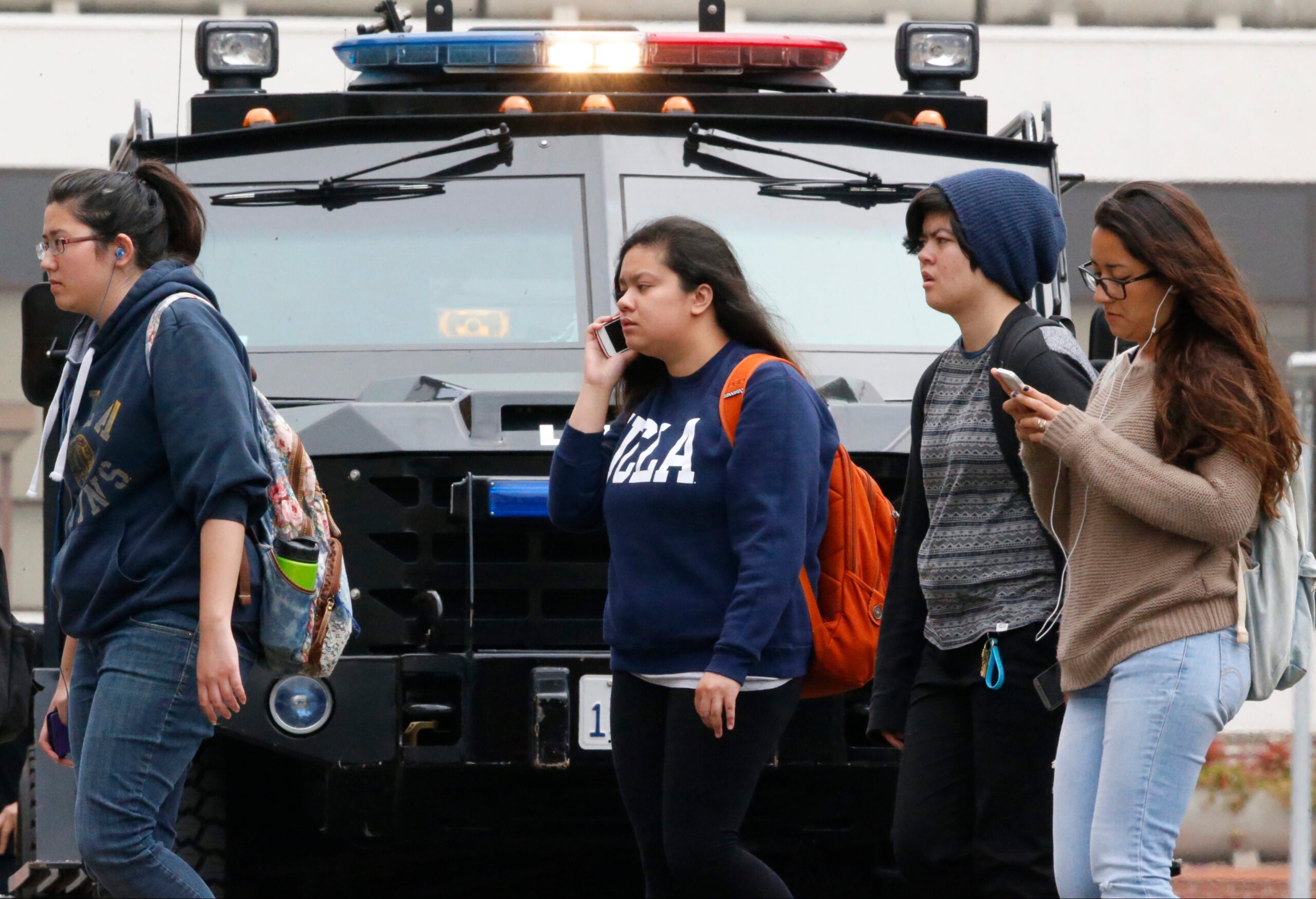 The Latest: Official IDs UCLA shooting victim as professor