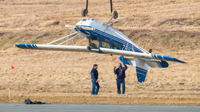 Small plane flips over as pilot lands aircraft at Beverly airport; no ...