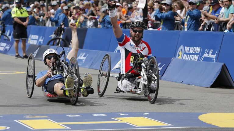 Patrick Downes crosses marathon finish line on handcycle