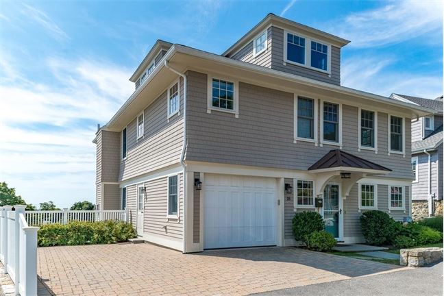 This open Colonial-style home boasts views of Swampscott Harbor