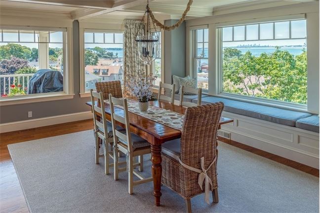 This open Colonial-style home boasts views of Swampscott Harbor