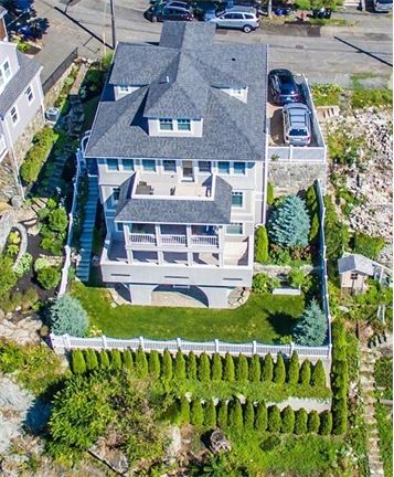This open Colonial-style home boasts views of Swampscott Harbor