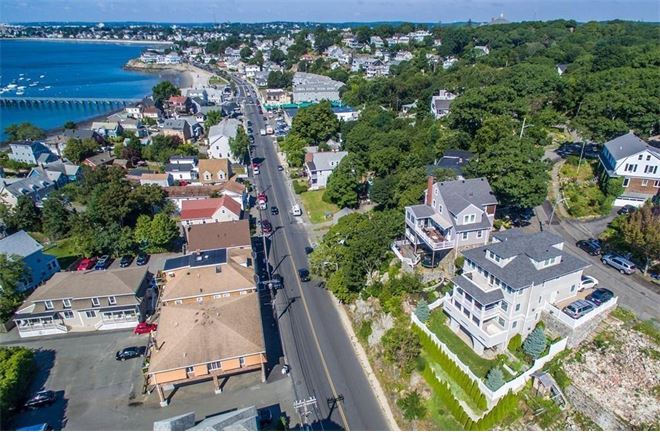 This open Colonial-style home boasts views of Swampscott Harbor