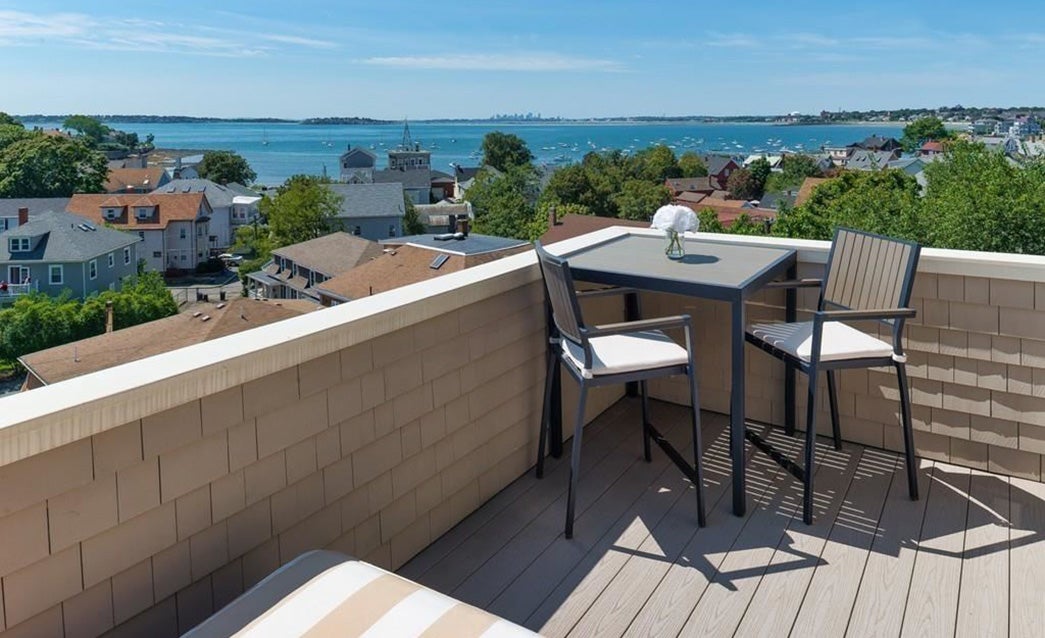 This open Colonial-style home boasts views of Swampscott Harbor