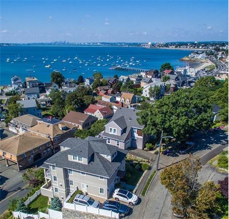 This open Colonial-style home boasts views of Swampscott Harbor