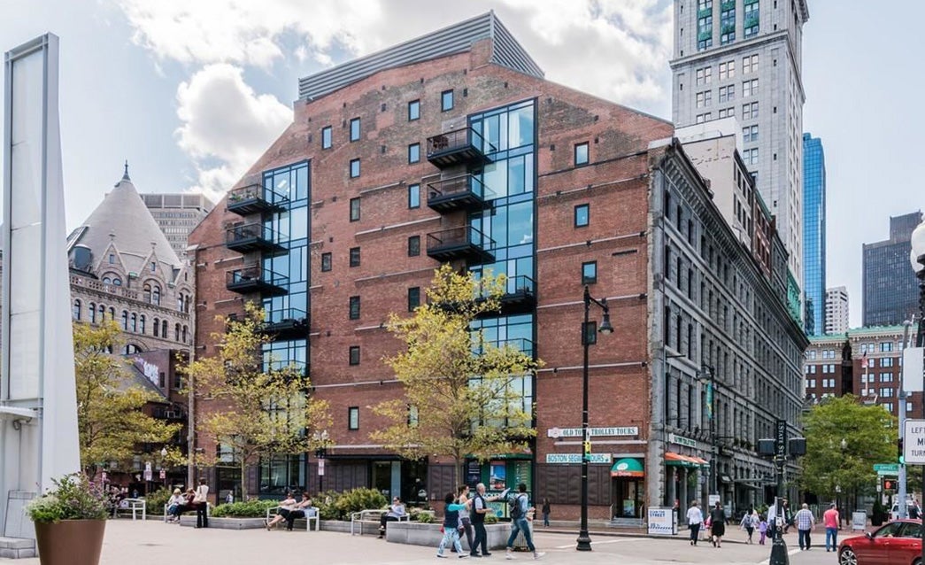 Downtown Boston loft-style condo has 12-foot beamed ceilings, terrace