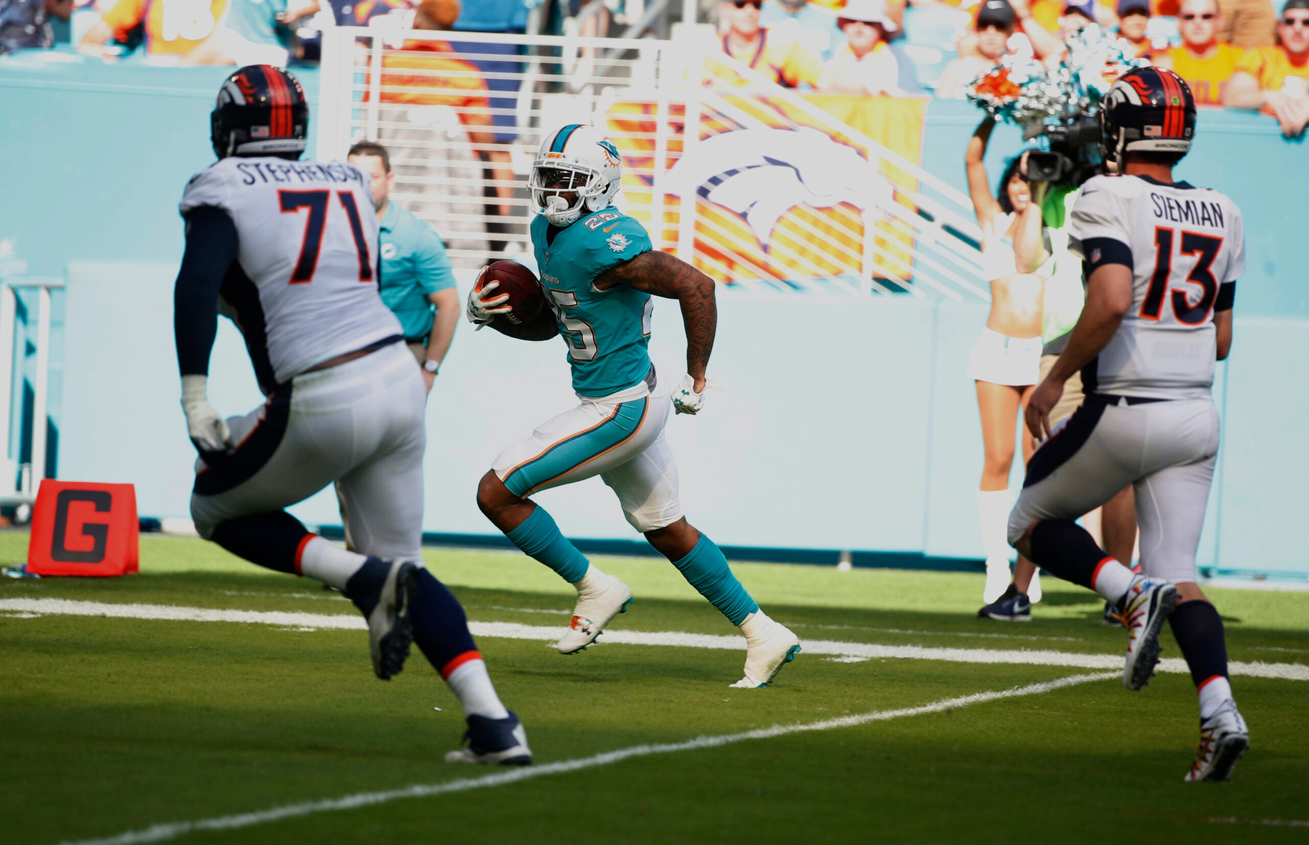 Dolphins end 5-game losing streak by beating Broncos 35-9