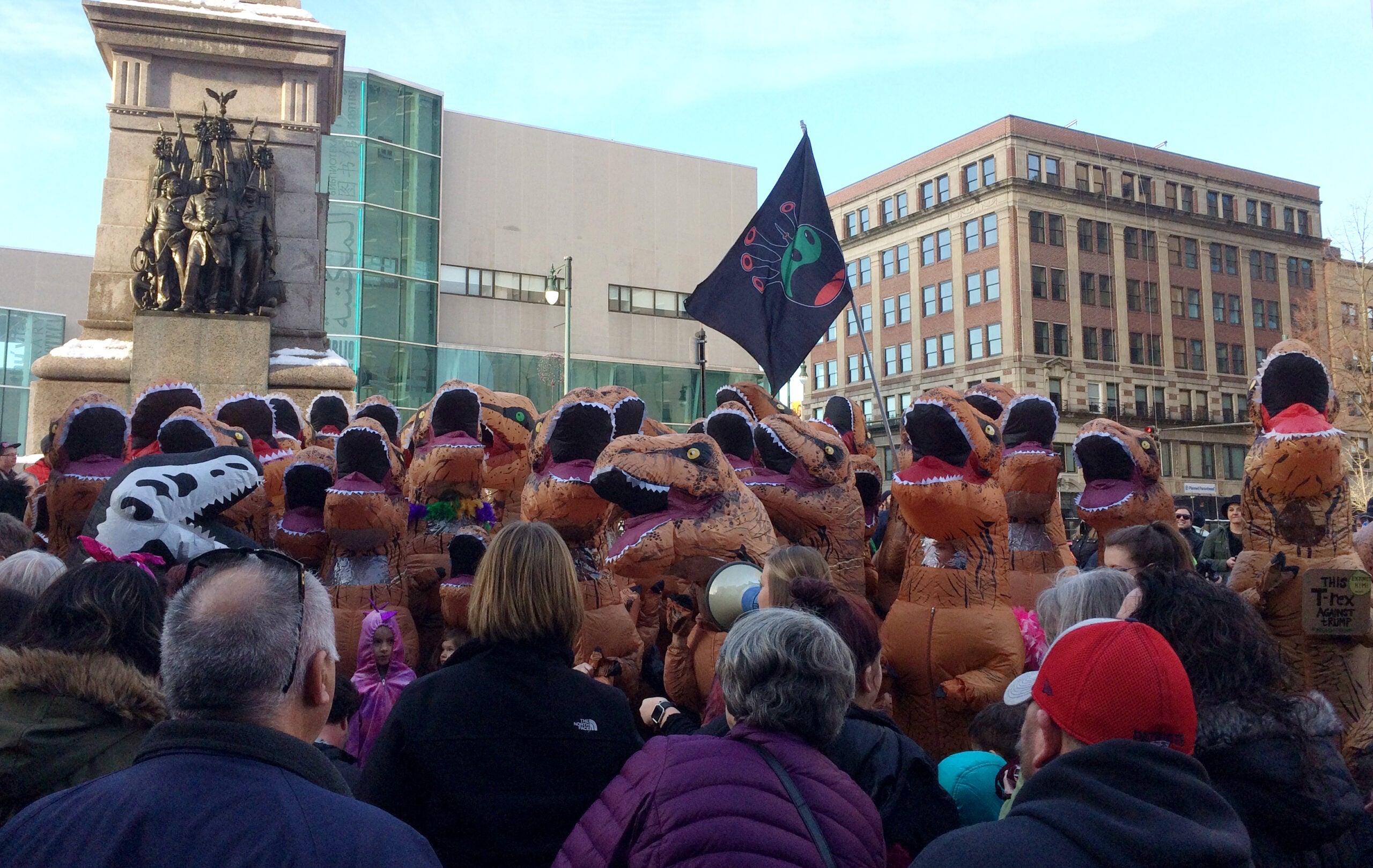 Watch: Dozens dressed as T. rex take over public square in Portland, Maine