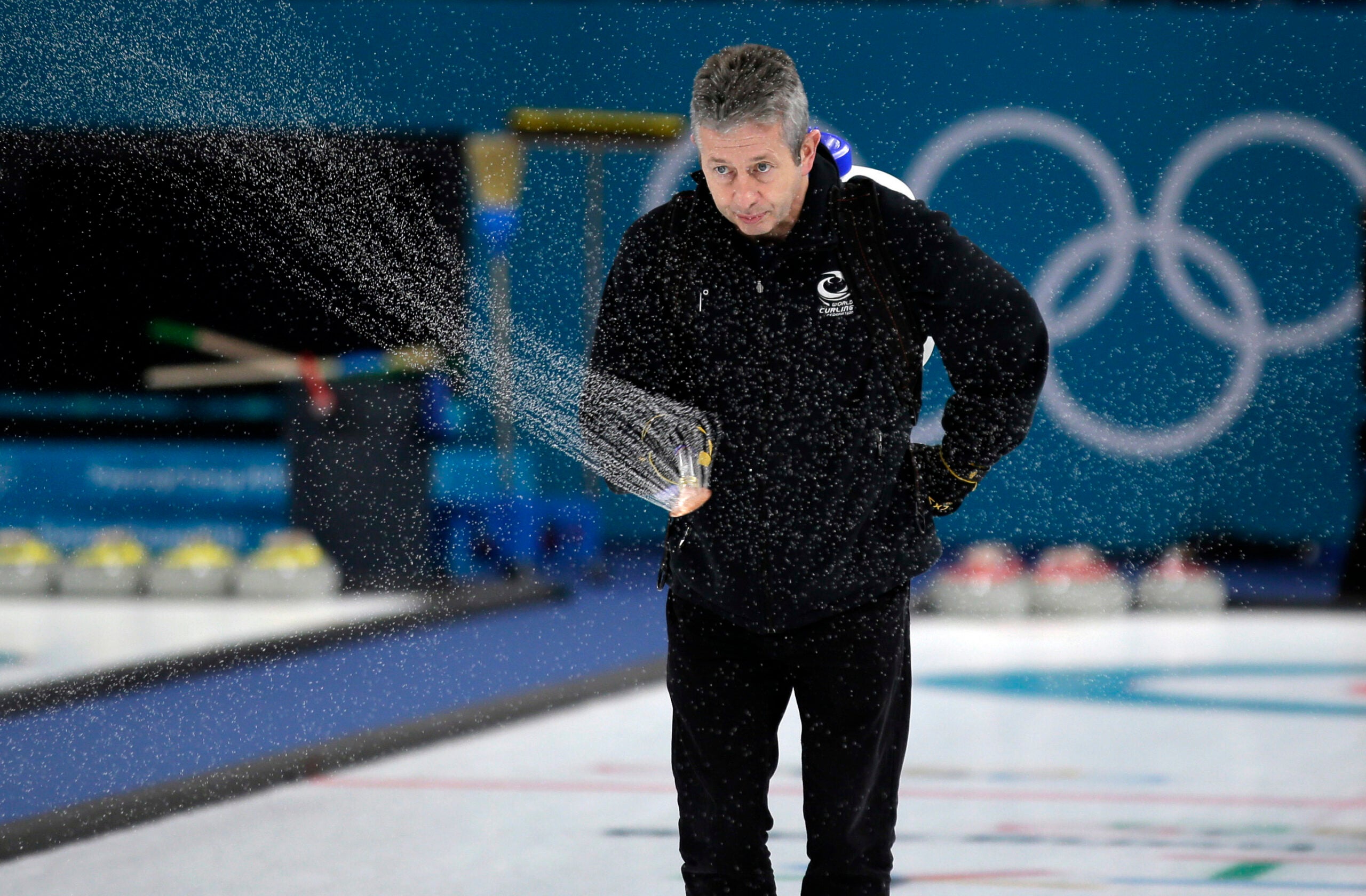 Before the curling, icemasters go to work on Olympic surface