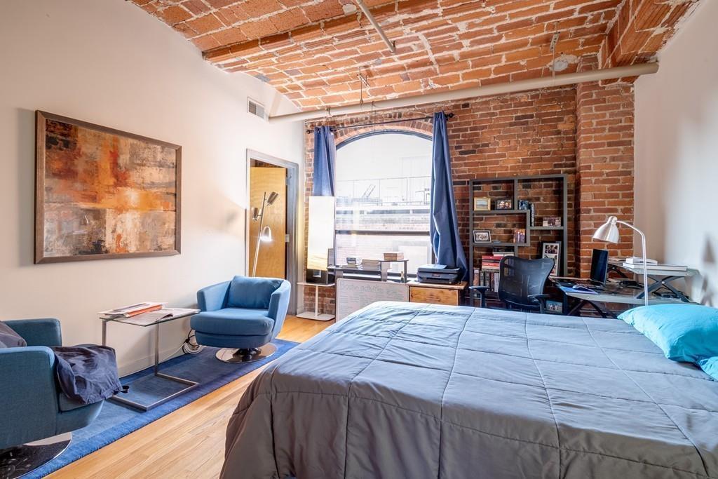 For $1.3M, Leather District loft with rolling brick ceilings