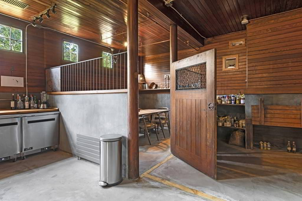 Carriage house home has a horse-stall dining area