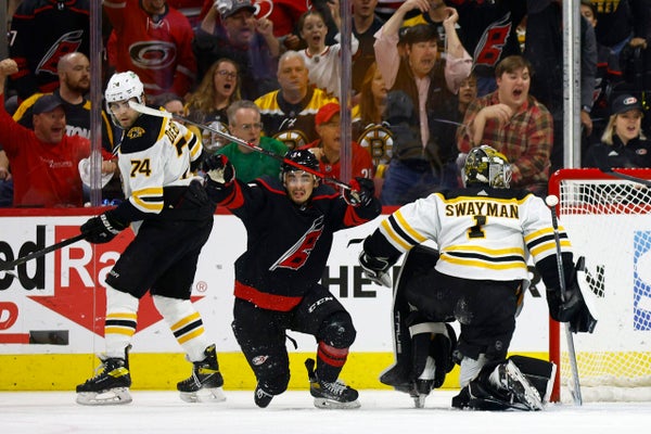 Brad Marchand leaves game with upper body injury after a 'cheap' hit