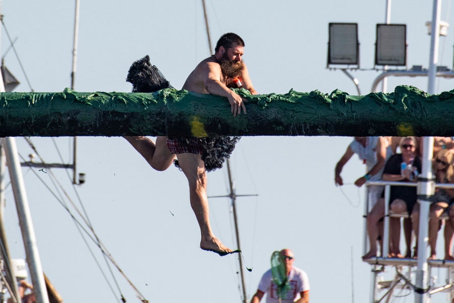Watch: Gloucester's greasy pole contest looks as painful as ever