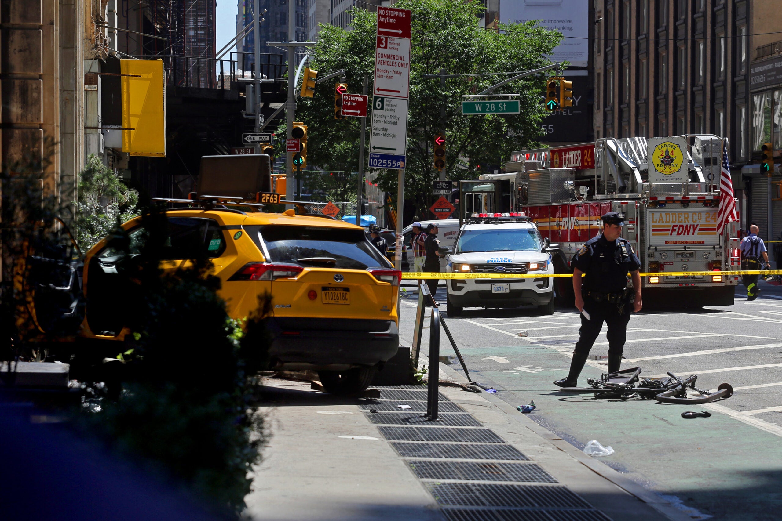 Police: 3 critically hurt when taxi jumps curb in Manhattan