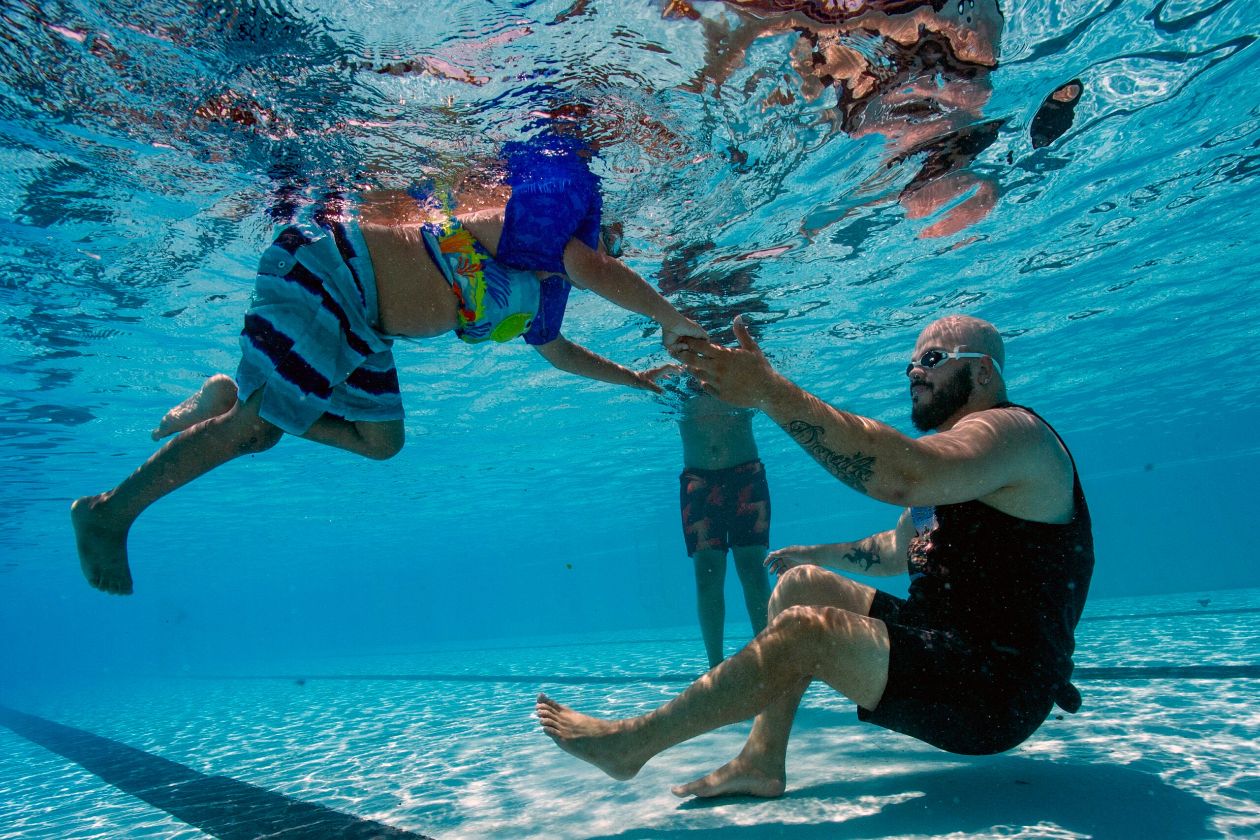 Pool pix: Boston heads underwater to beat the heat