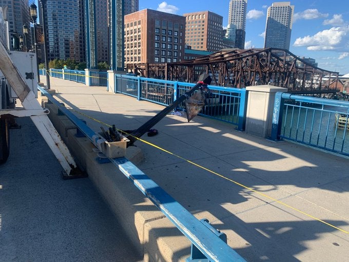 Woman suffers serious injuries after Moakley Bridge light pole falls on her