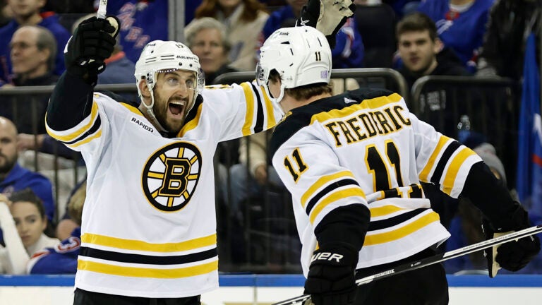 Bruins score 4 in 3rd, beat Rangers 5-2 for 7th straight
