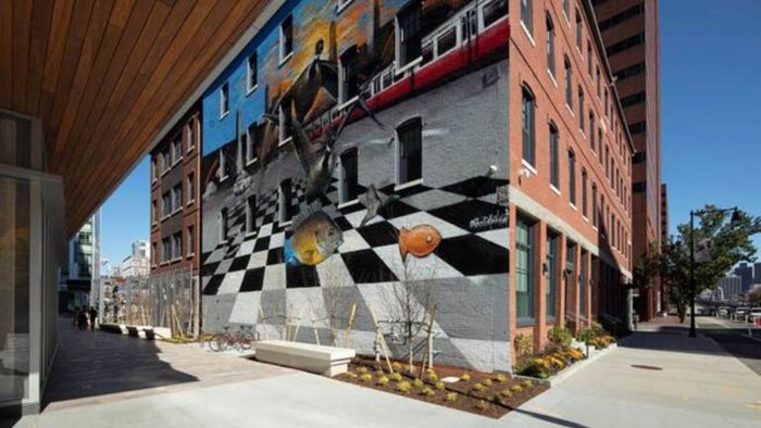 Artist honors Muhammad Ali with moving Central Square mural