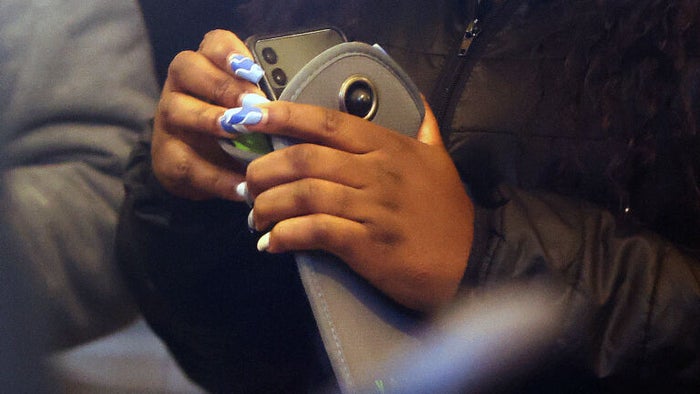 Some Mass. schools are locking up phones. Students aren't happy about it.