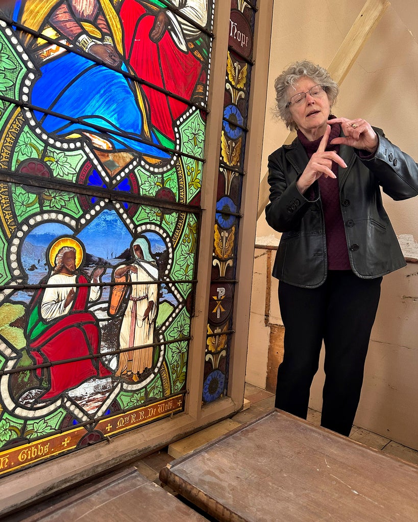 Stained glass window shows Jesus Christ with dark skin, stirring ...