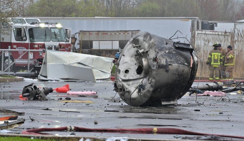 Photos: Manhole explodes, metal cover lands on Somerville roof