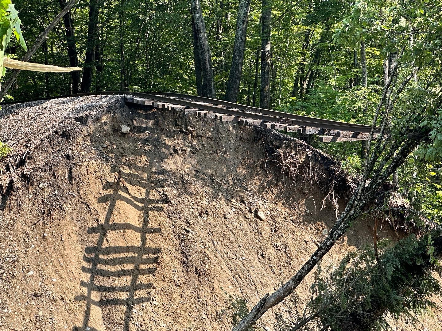 Vermont flooding leaves section of train tracks suspended in mid-air