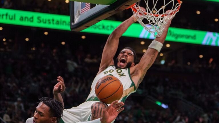 Watch: Jayson Tatum issued technical for hanging on rim after dunk