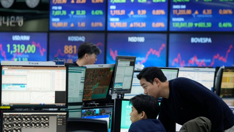 Wall Street hits record high following a 2-year round trip scarred by inflation