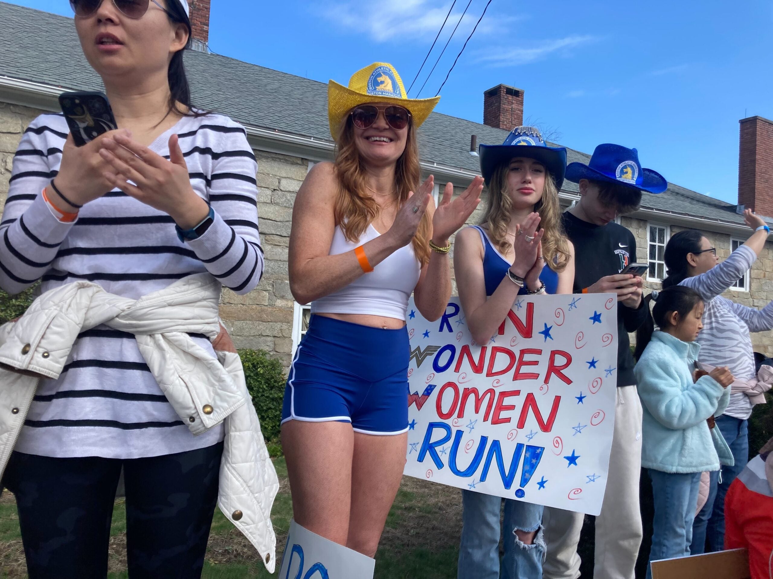 The best signs spotted along the 128th Boston Marathon route