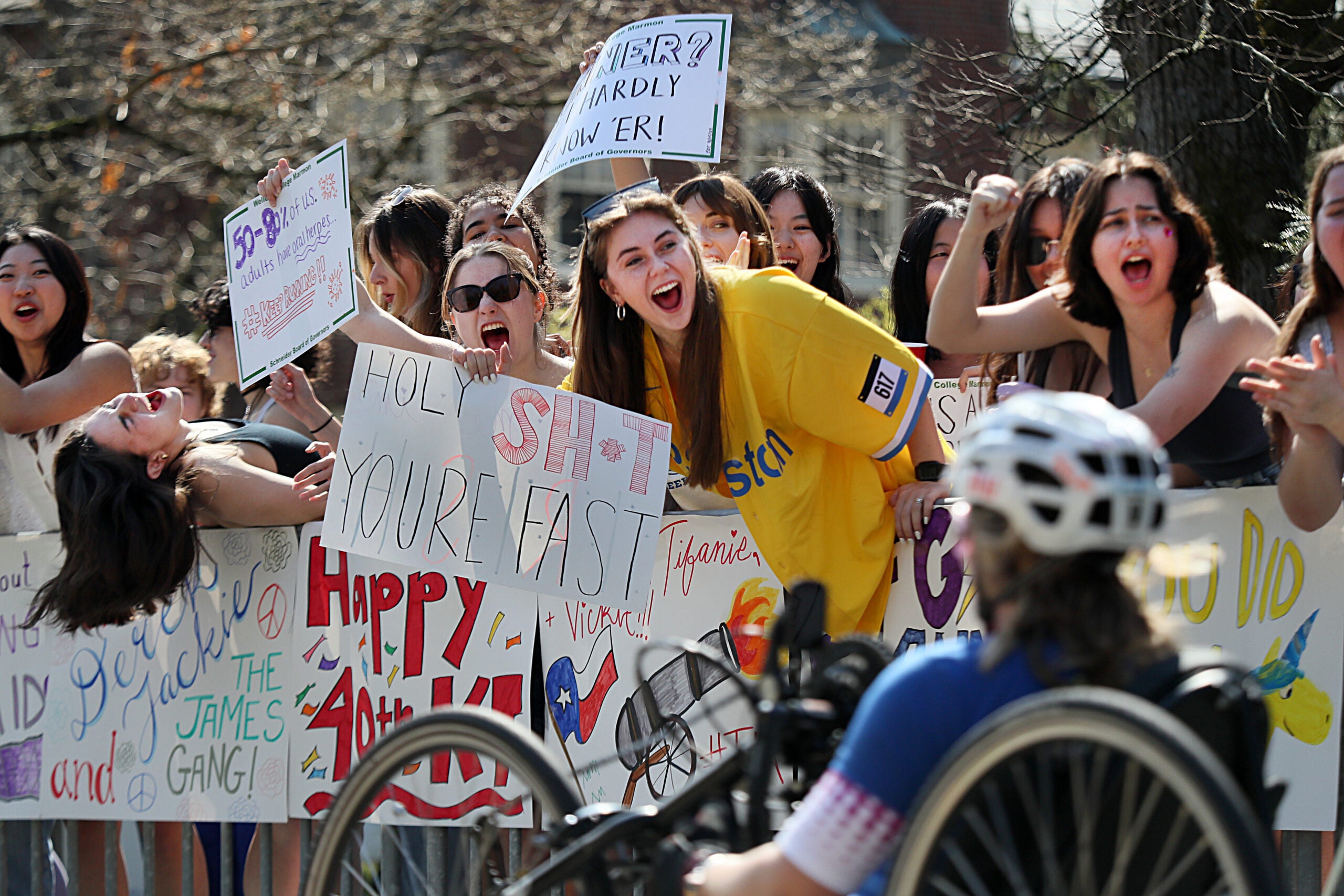 The best signs spotted along the 128th Boston Marathon route