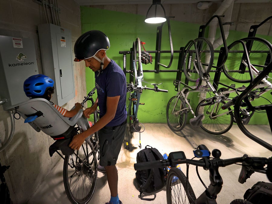 More Bostonians are biking as bike lanes boom, but barriers remain