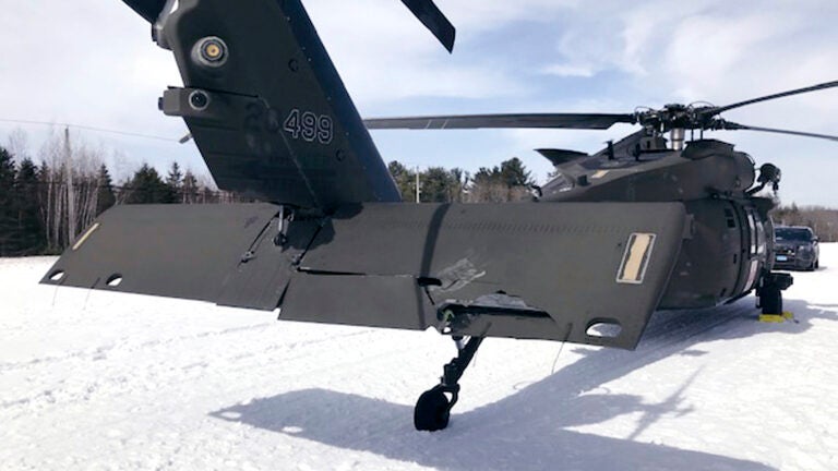 A snowmobiler who crashed into a parked Black Hawk helicopter on a Mass ...