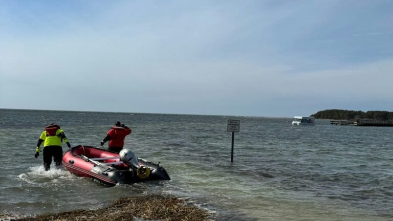 FedEx driver rescued after high tide submerges truck off Cape