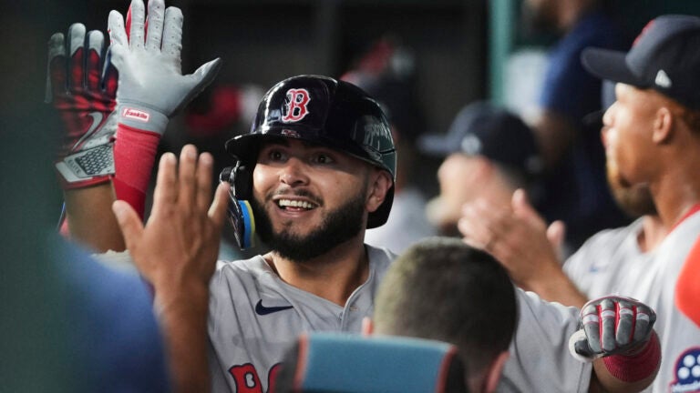 Abreu's 2 home runs power Red Sox past Rangers 5-2