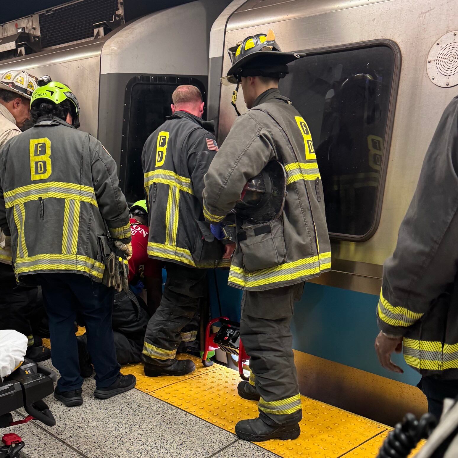Boston firefighters rescue man from underneath Blue Line train