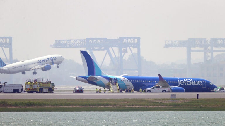 Watch: Video shows plane rolling off Logan runway