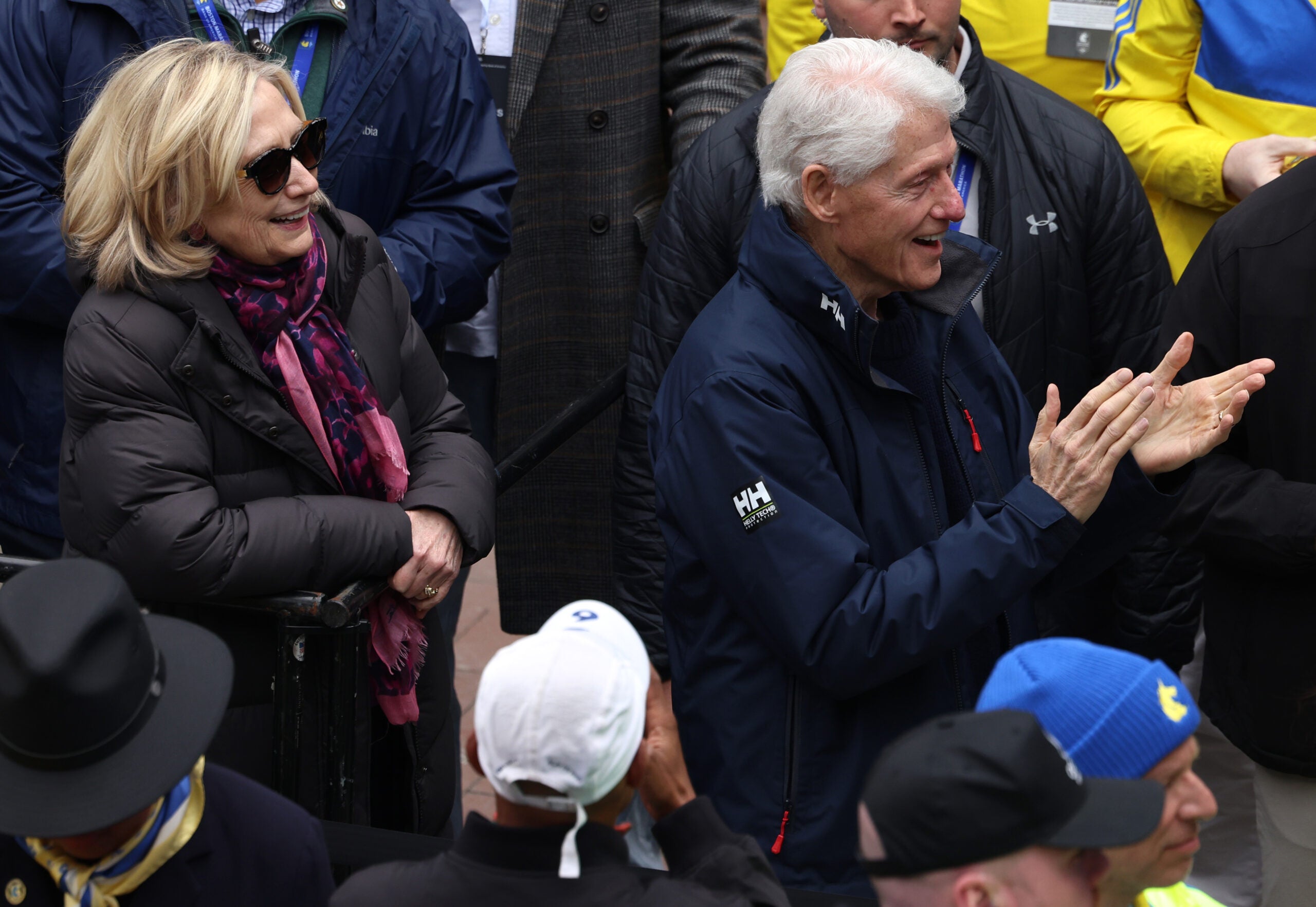 Hillary and Bill Clinton cheer on Chelsea at Boston Marathon