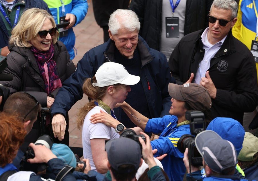 Hillary and Bill Clinton cheer on Chelsea at Boston Marathon