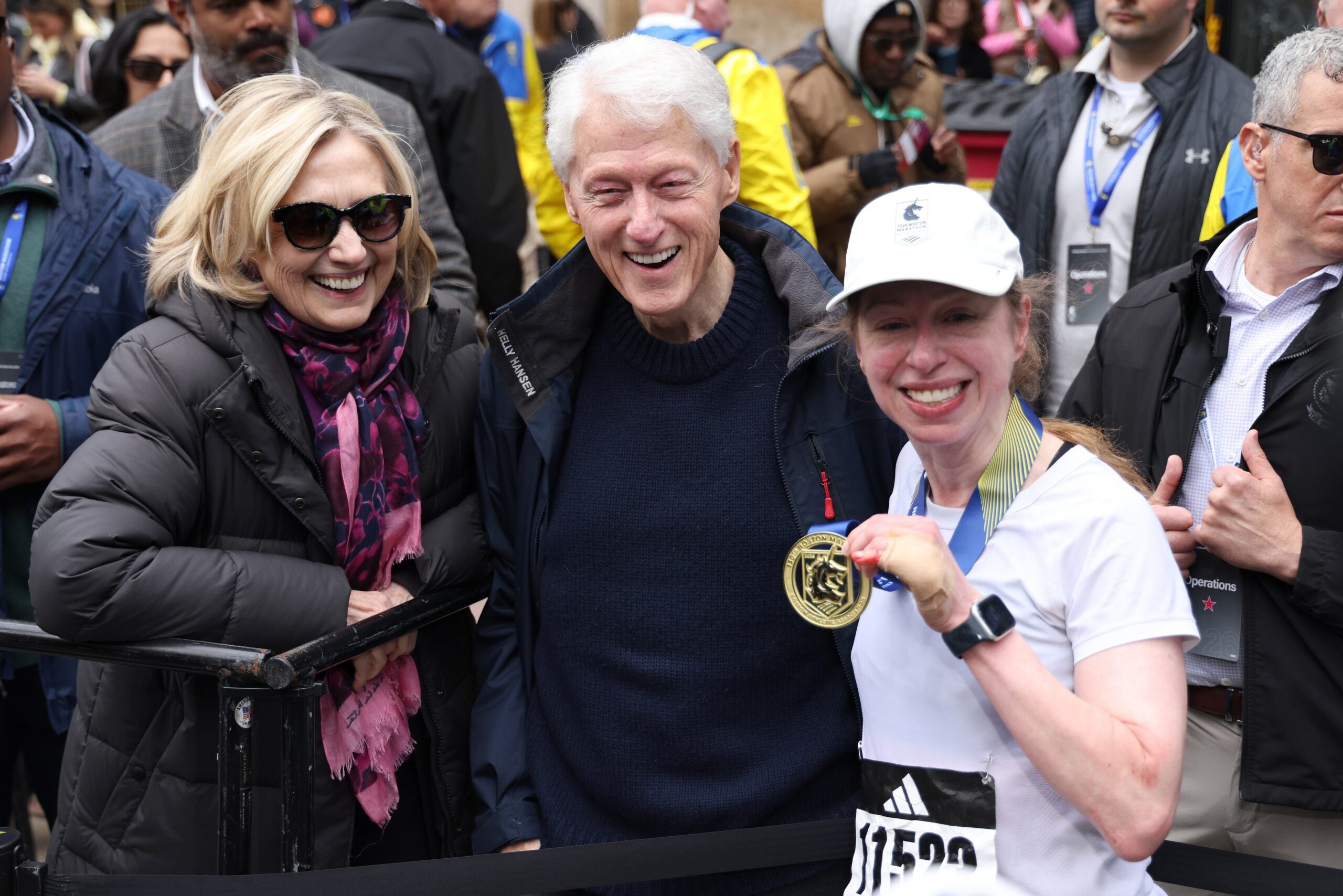 Hillary and Bill Clinton cheer on Chelsea at Boston Marathon